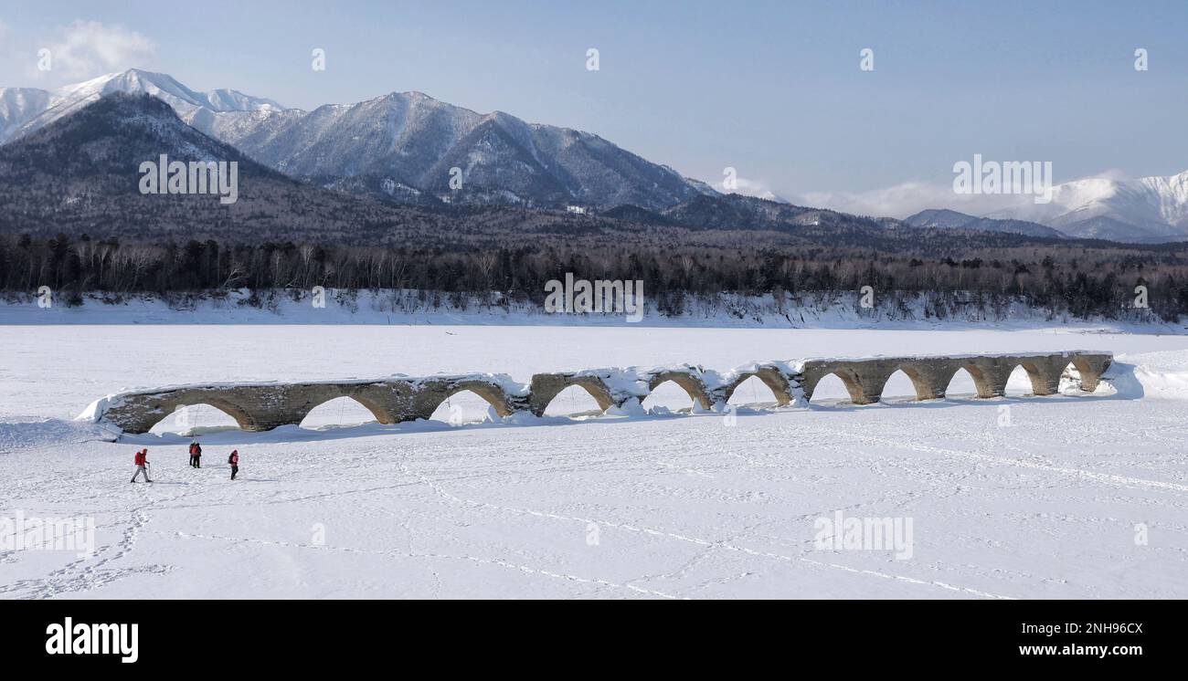 The "Taushubetsu River Bridge" appears over frozen Lake Nukabira in ...