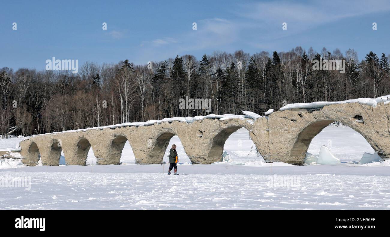 The "Taushubetsu River Bridge" appears over frozen Lake Nukabira in ...