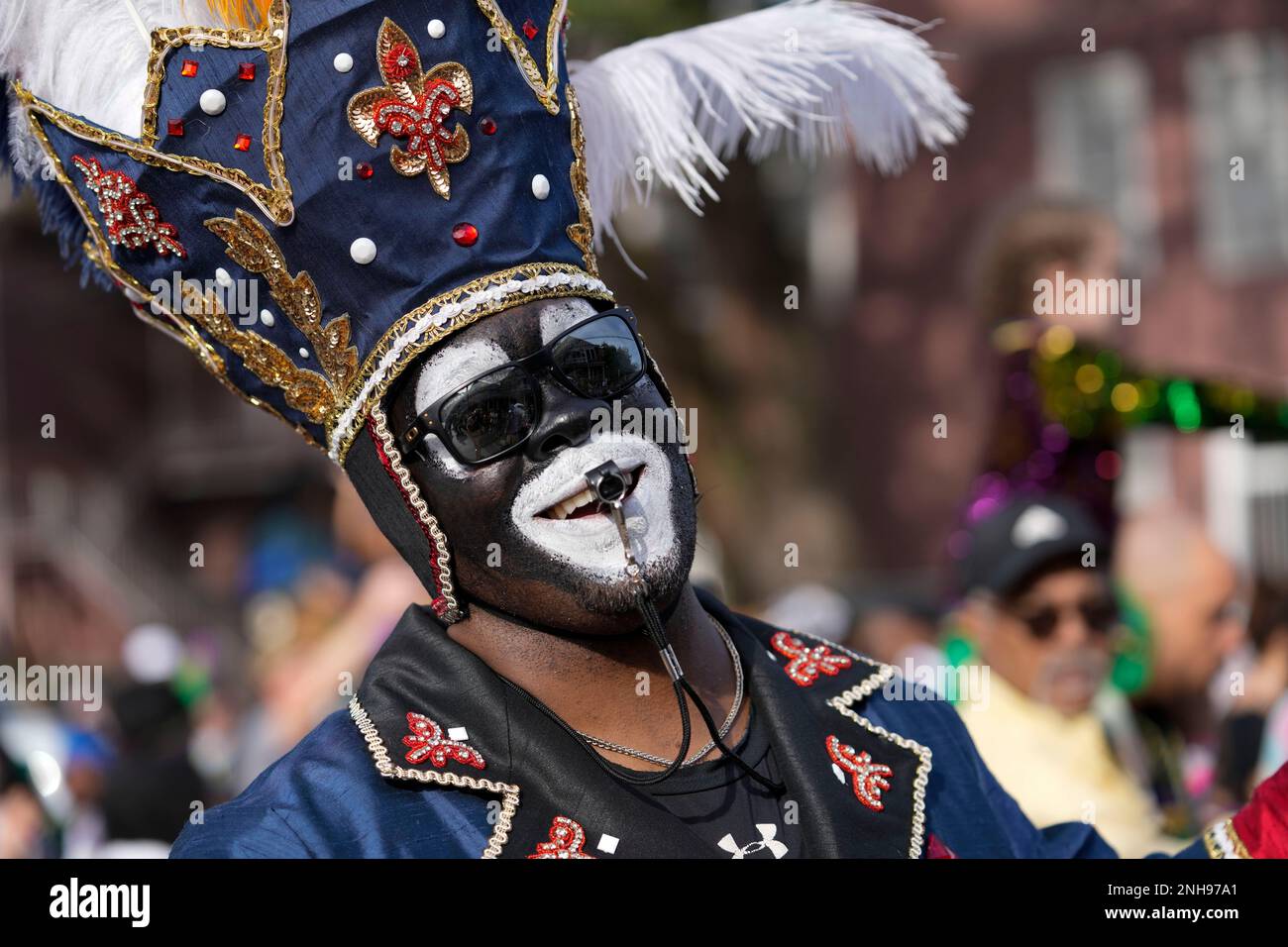 A member of the traditional Mardi Gras group The Tramps marches during ...