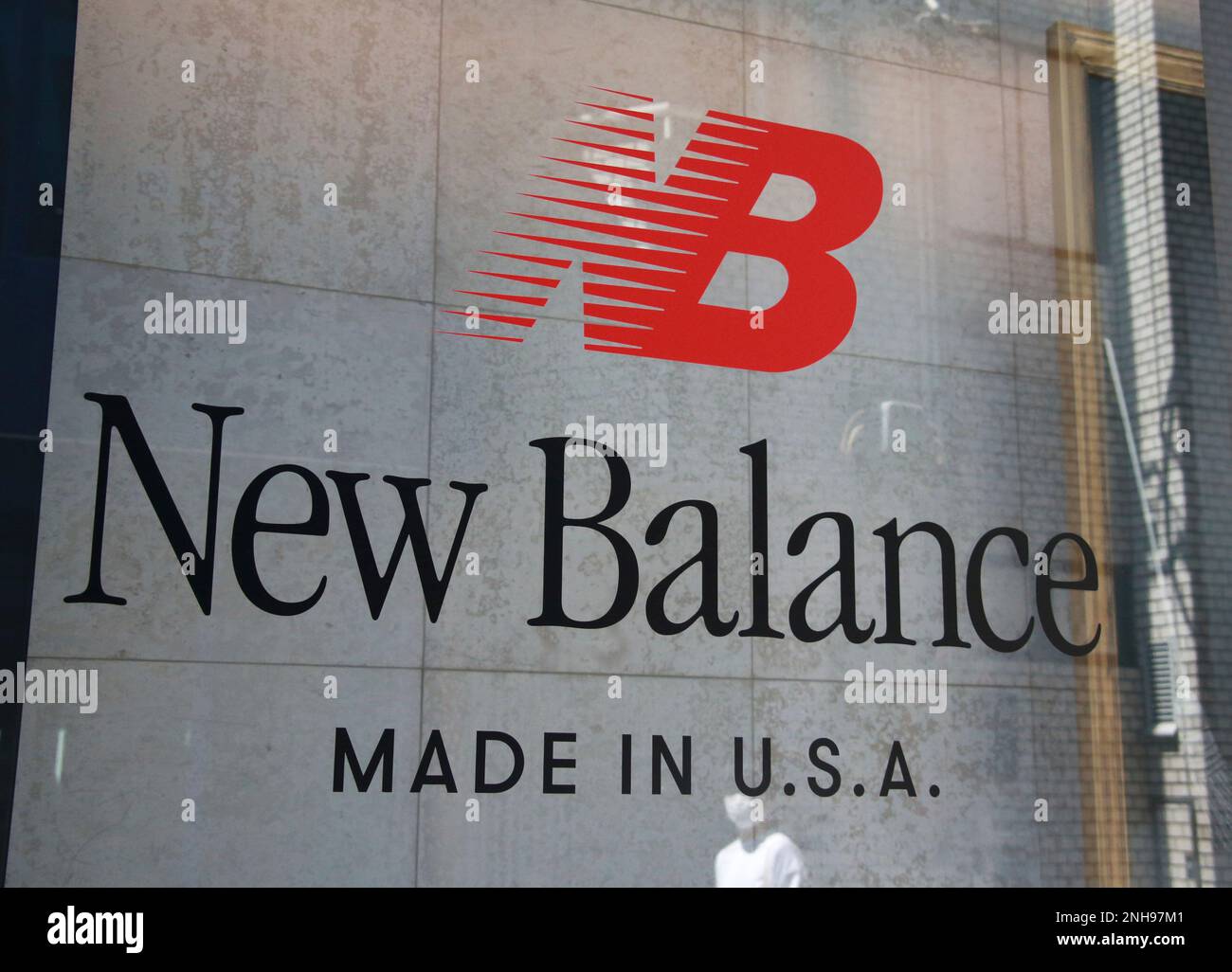The logo of New Balance is seen in Shibuya Ward, Tokyo on May 29, 2022 ...