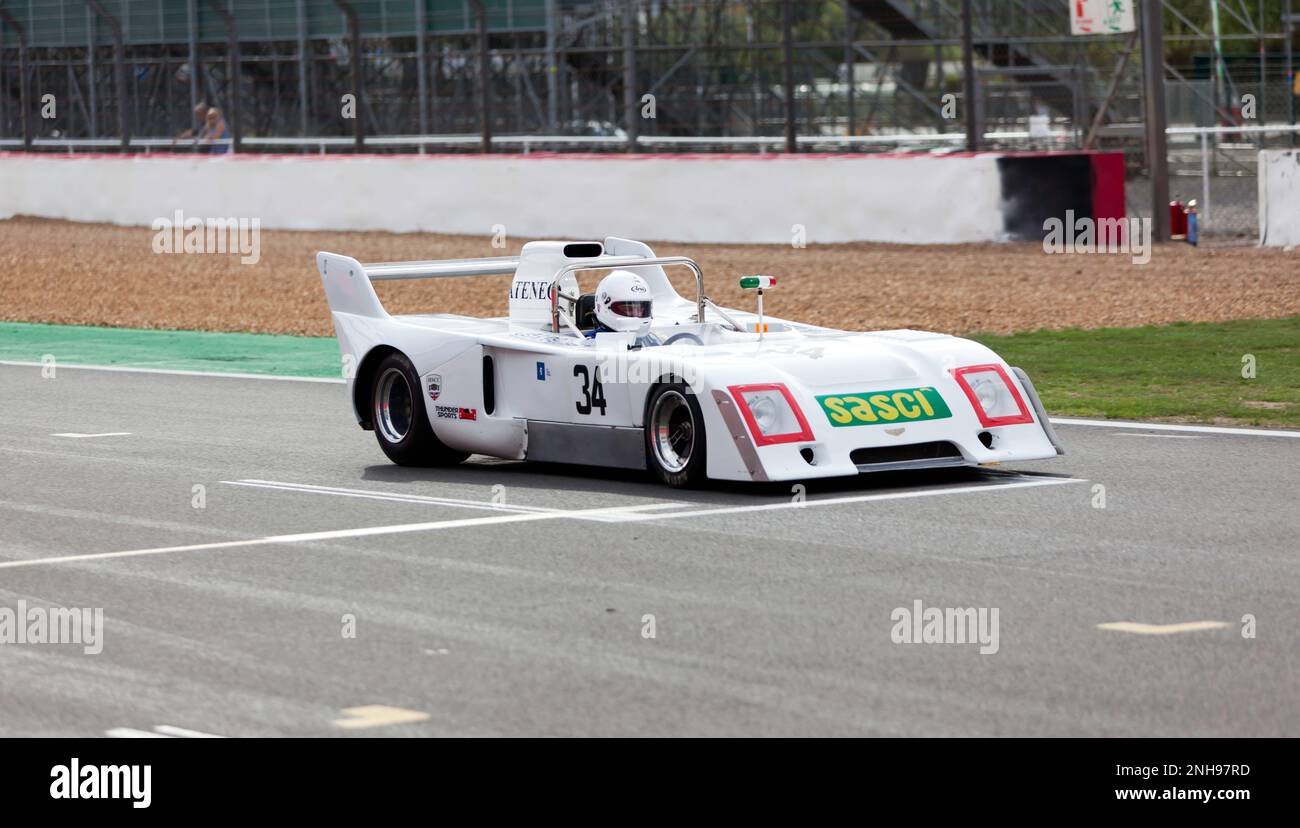 Close-up of James Schryver driving his 1974, White, Chevron B26 ...