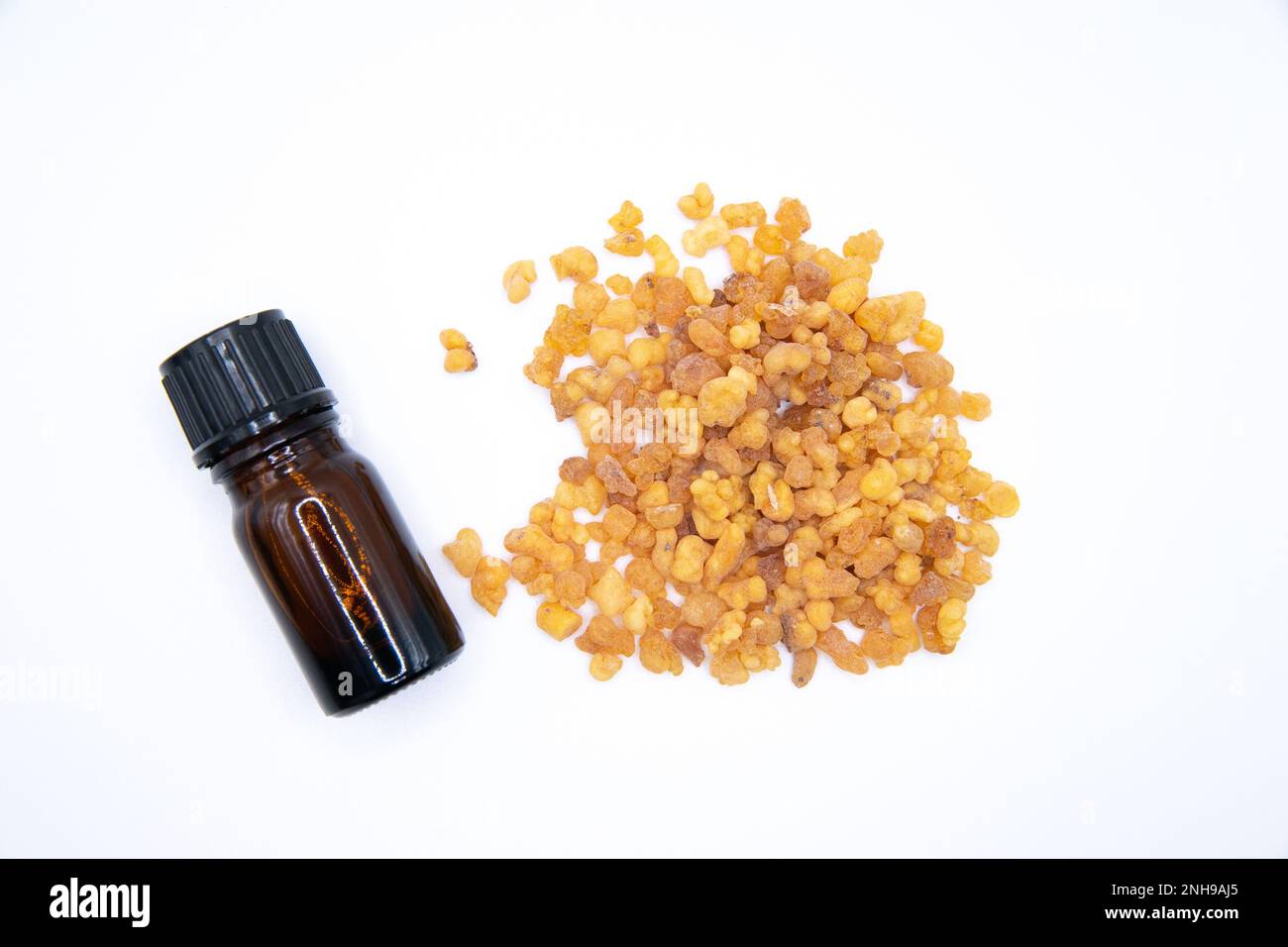 A bottle of frankincense essential oil with frankincense resin, close ...