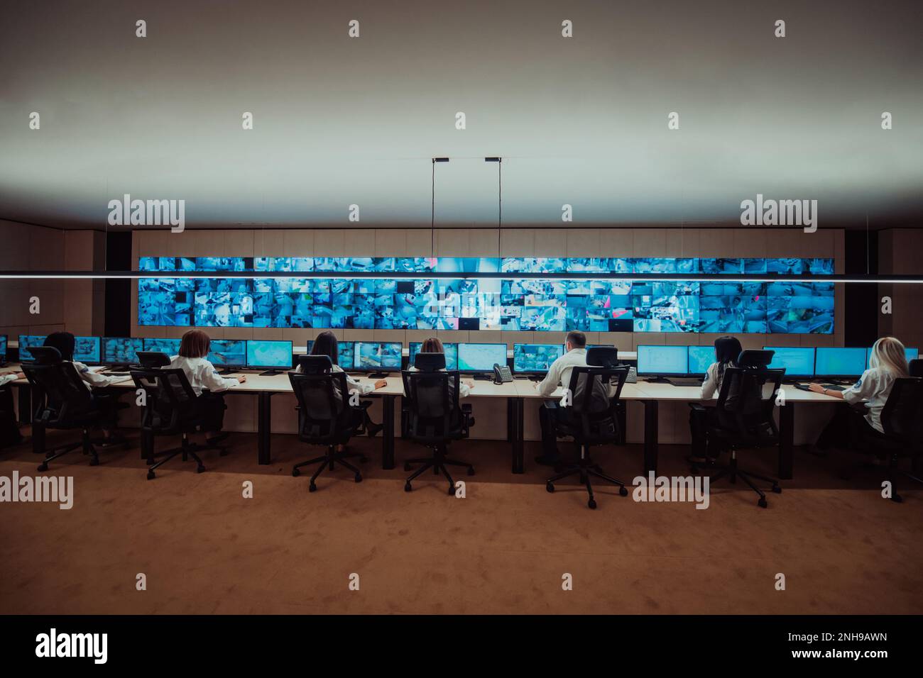 Group of Security data center operators working in a CCTV monitoring ...