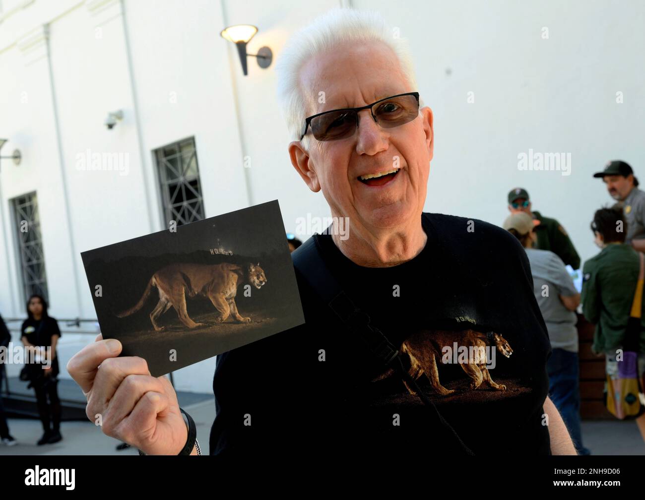 National Geographic photographer Steve Winter holds a postcard of his ...