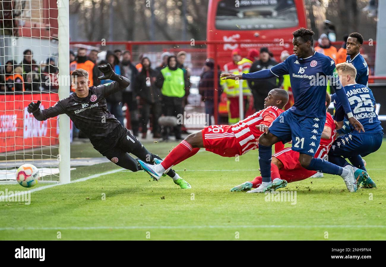 Berlin's Kevin Behrens, second from right, scores the opening goal ...