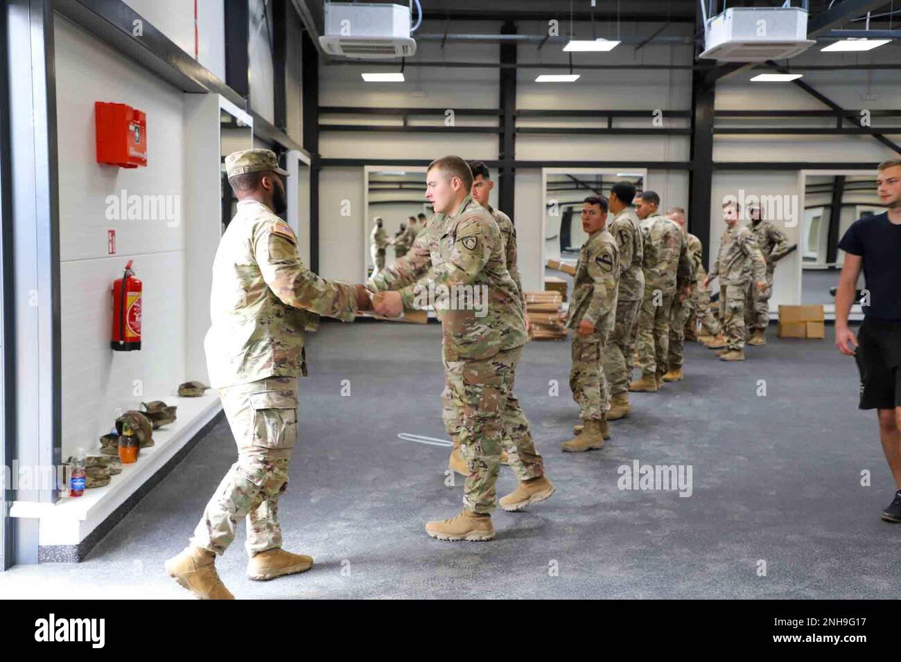 New equipment is moved inside the new gym at Drawsko Pomorskie Training ...