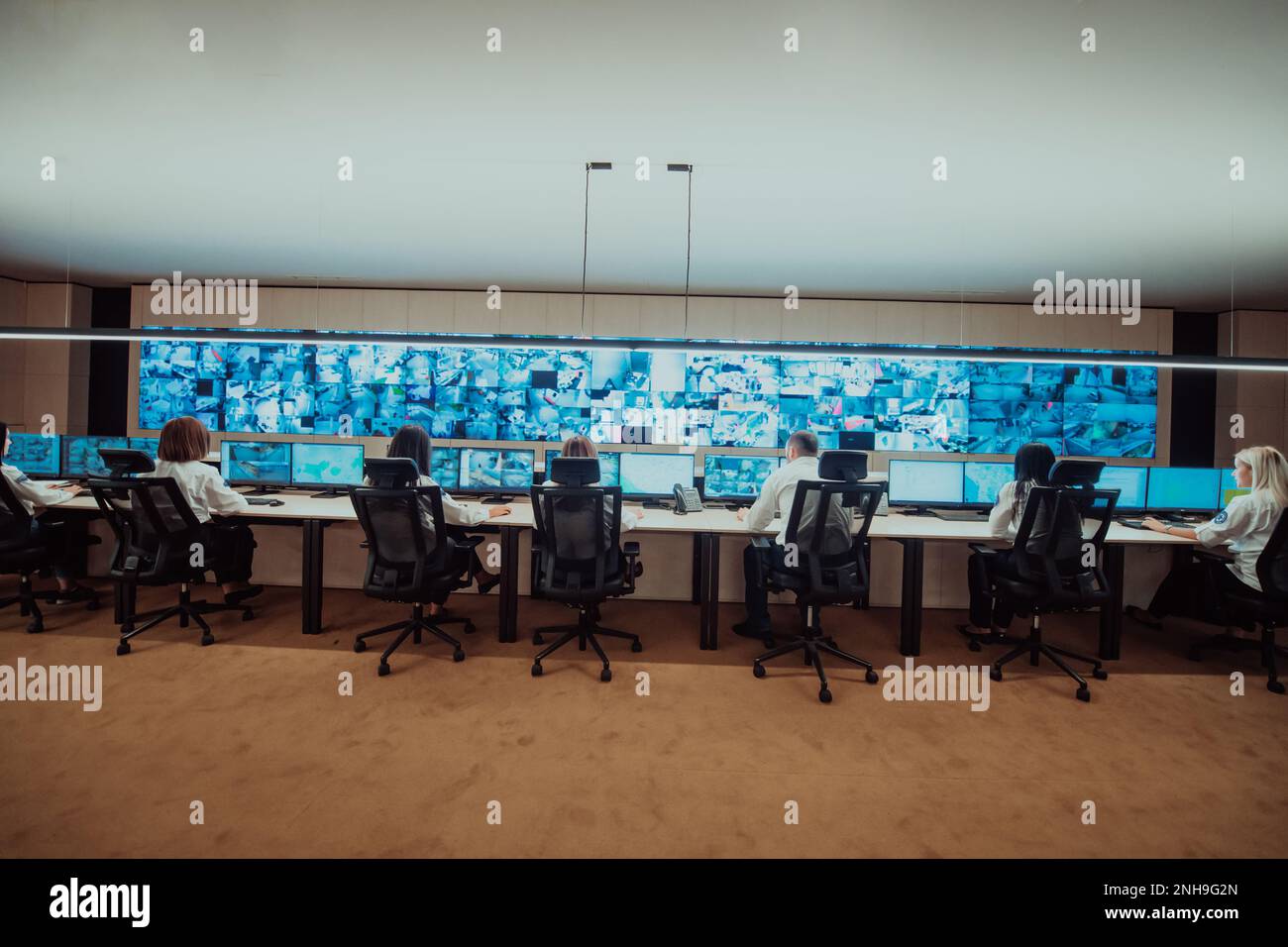 Group of Security data center operators working in a CCTV monitoring ...