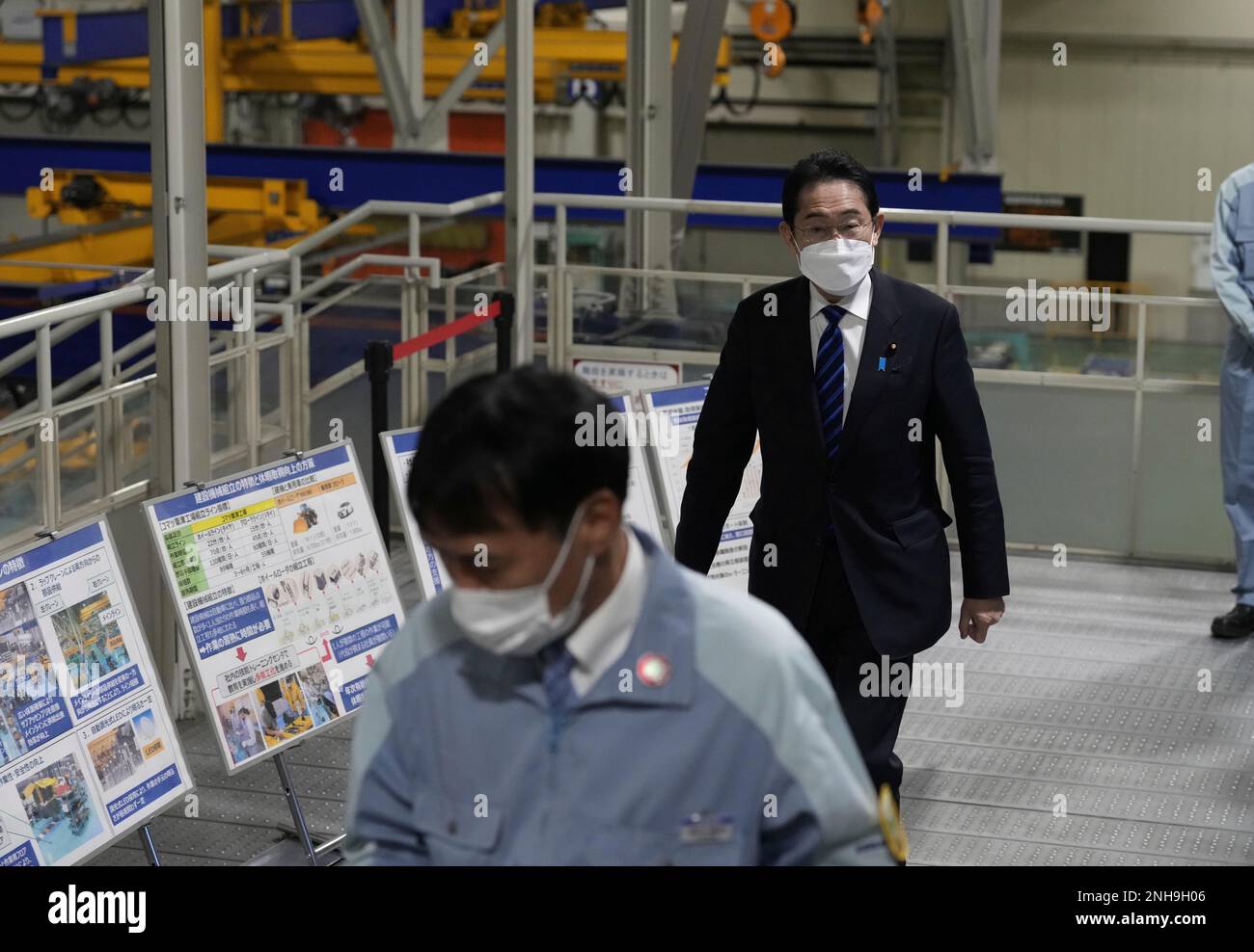 Japanese Prime Minister Fumio Kishida inspects a factory of Komatsu, a ...