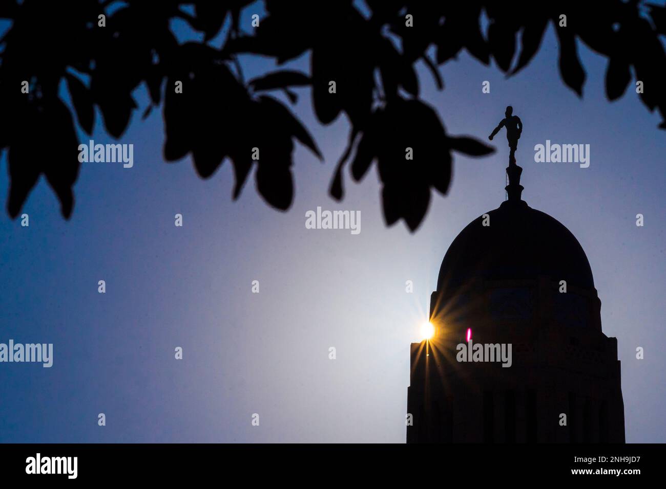 A passenger jet passes behind the Sower atop the 400 ft tall Nebraska ...