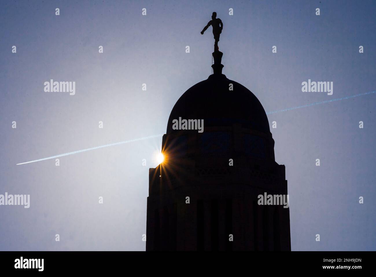 A passenger jet passes behind the Sower atop the 400 ft tall Nebraska ...