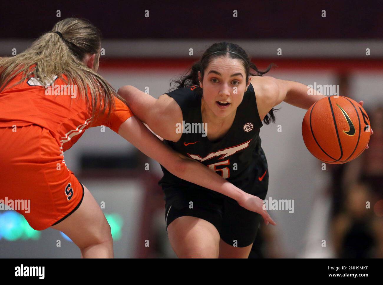 Virginia Tech's Georgia Amoore, right, drives past Syracuse's Georgia ...