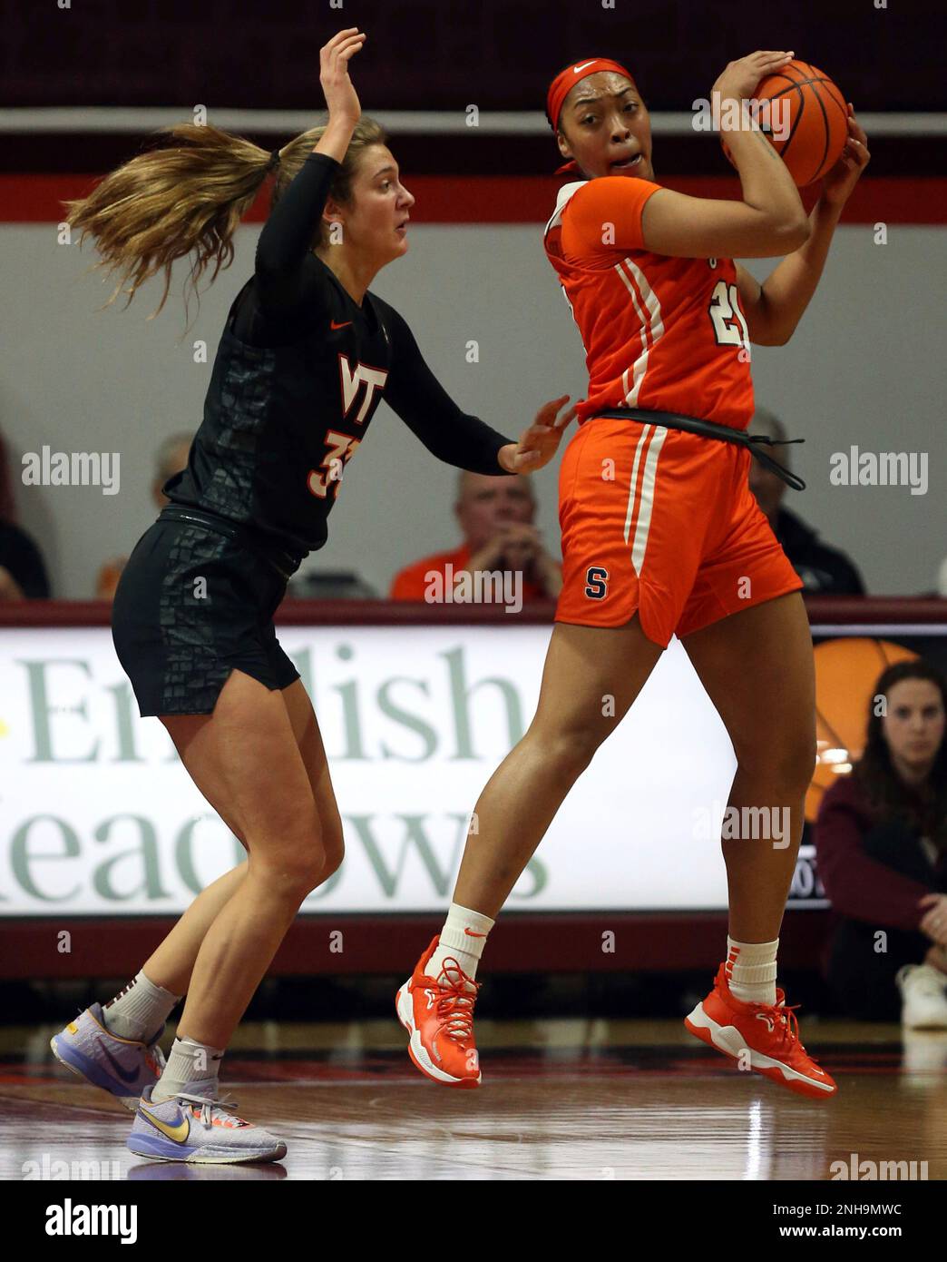 Virginia Tech's Elizabeth Kitley (33) left, defends Syracuse's Saniaa ...