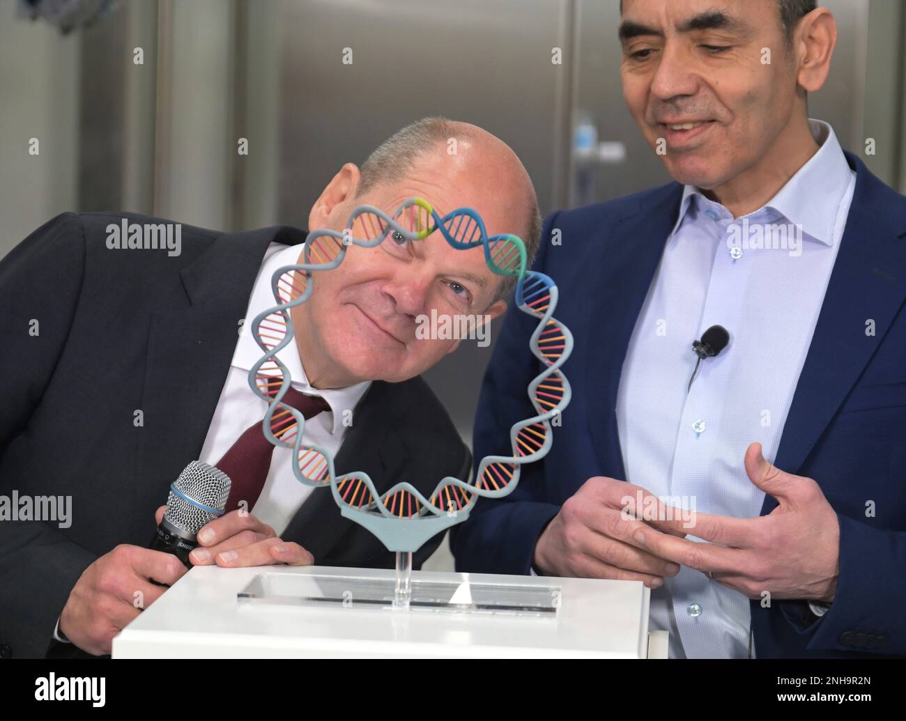German Chancellor Olaf Scholz, left, is given a tour of the laboratory ...