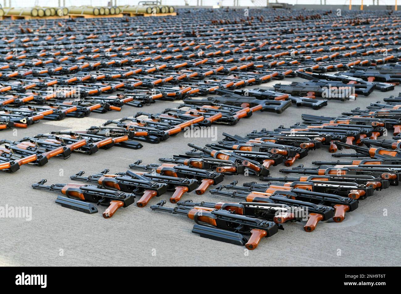 Assault rifles and missiles seized by the French navy lay on the deck ...