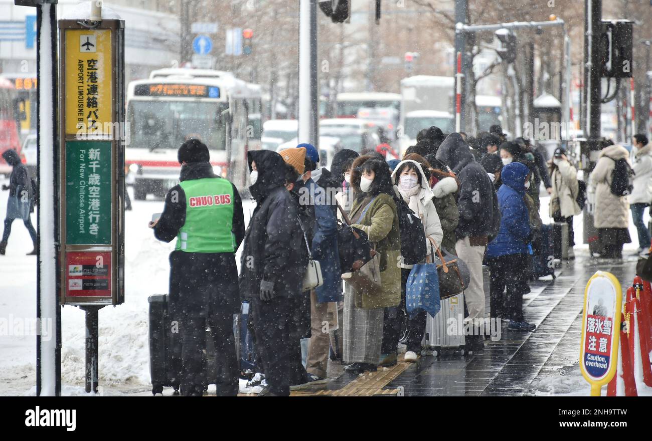Passengers wait for a bus which heads for New Chitose Airport at a bus ...