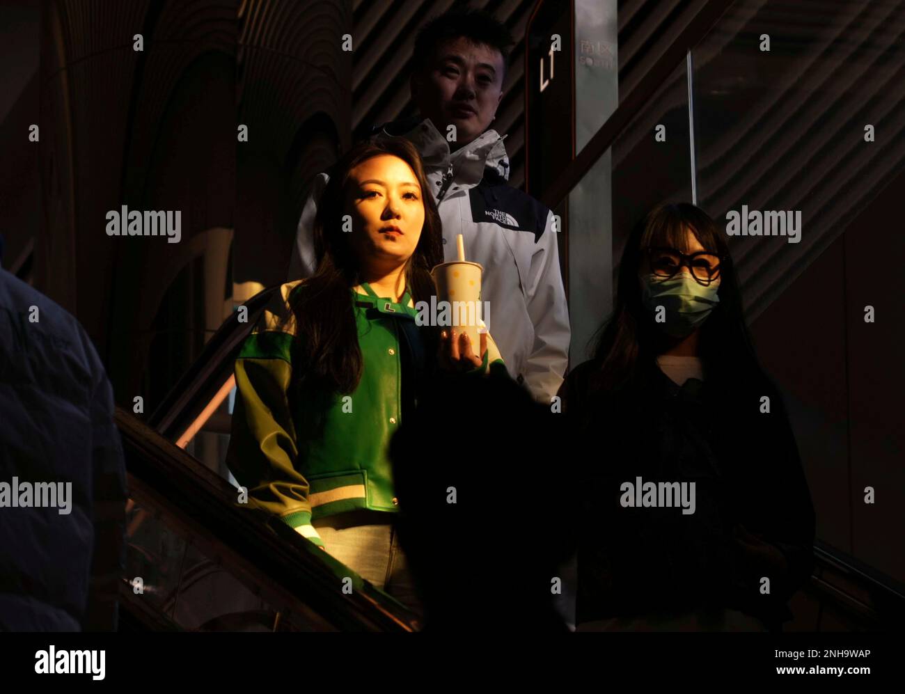 People not wearing masks are pictured at a busy area in Beijing, China ...