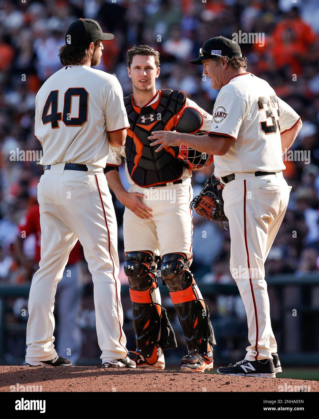 Giants pitching coach Dave Righetti talks to Madison Bumgarner and ...