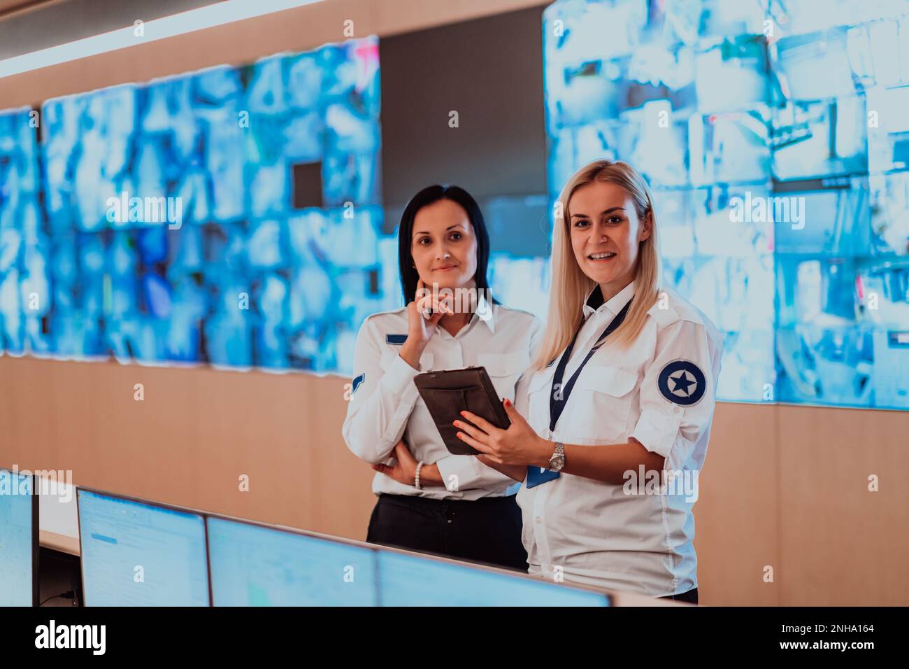 Group portrait of female security operator while working in a data ...