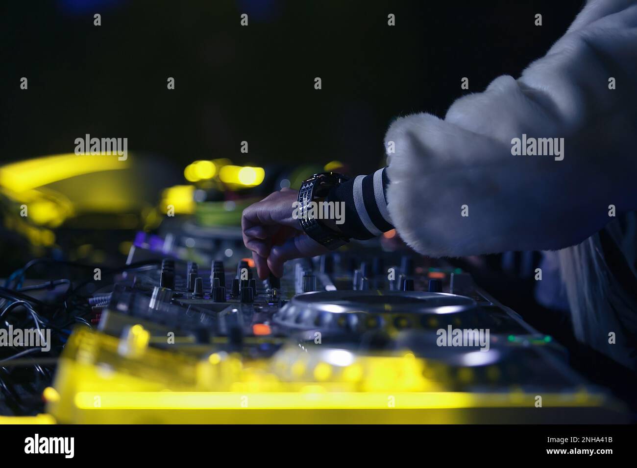 Hip hop dj girl plays music on stage. Hands of female disc jockey ...