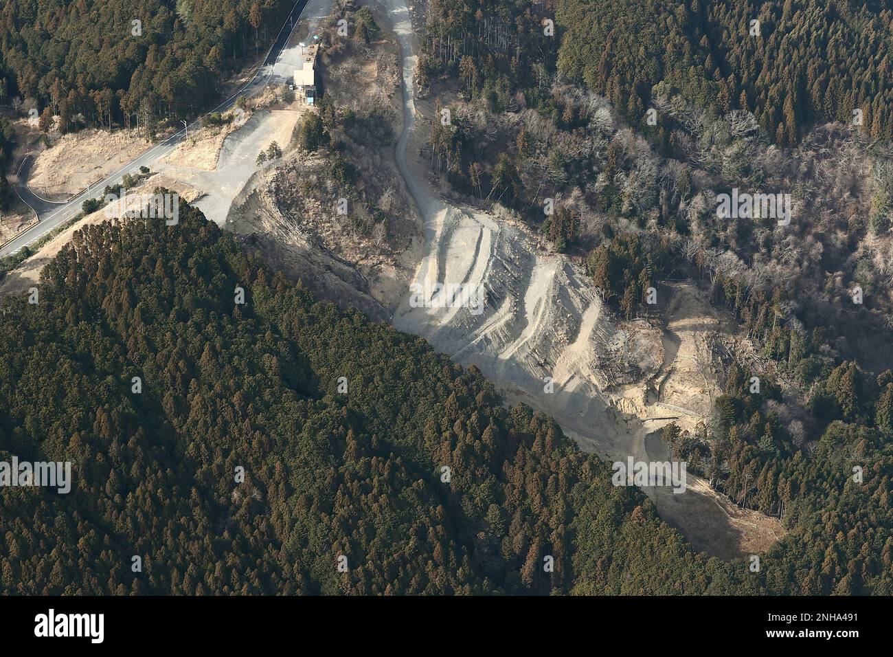 A photo shows a mound formed by piling up the soil on a mountain in ...
