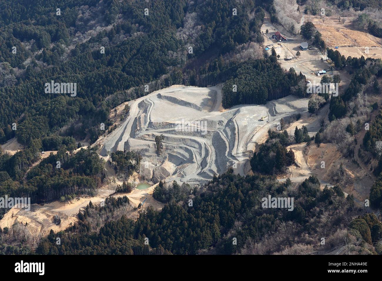 A photo shows a mound formed by piling up the soil on a mountain in ...