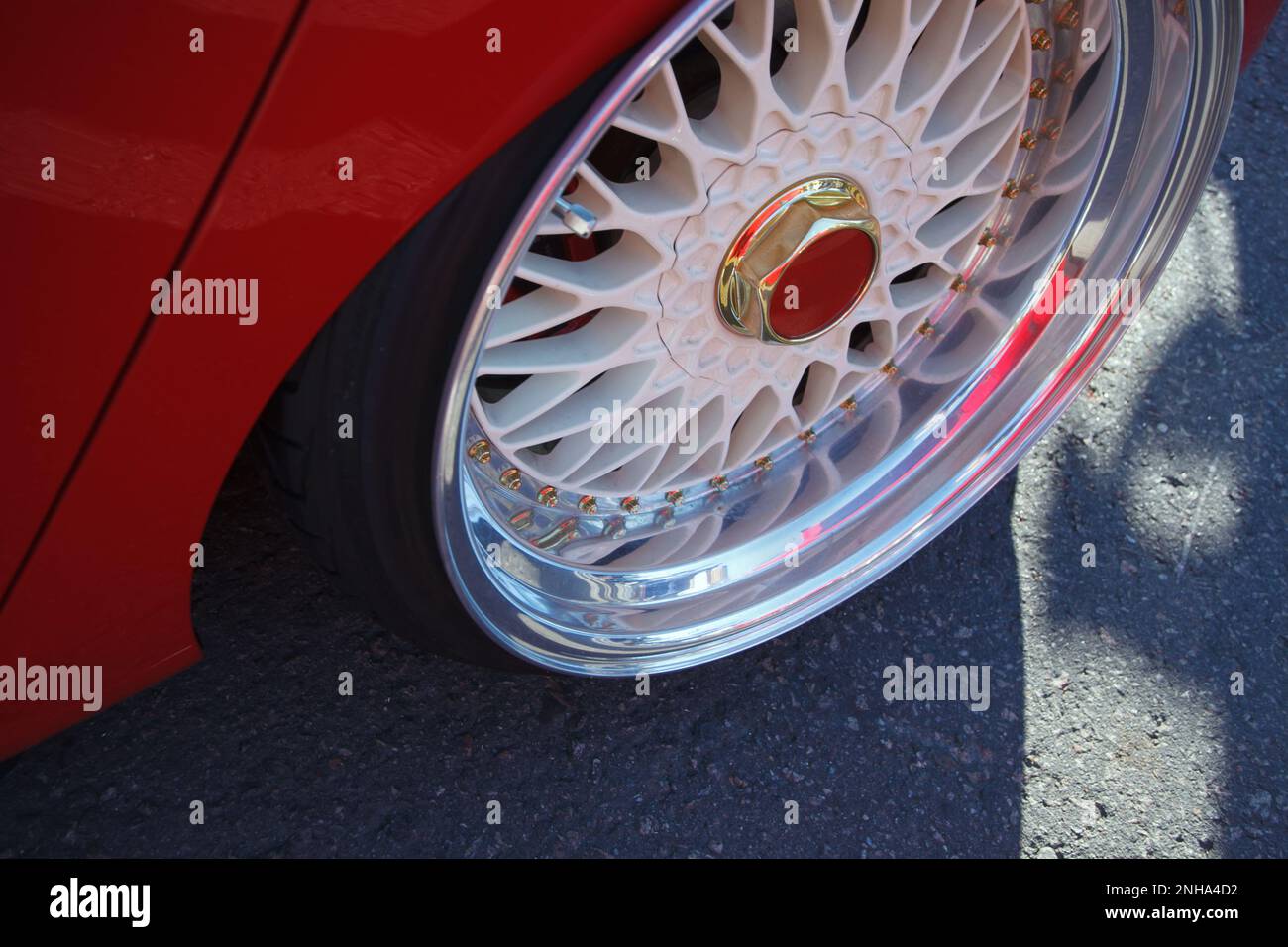 Low profile chrome wheel on tuner car. Custom polished rims on sports ...