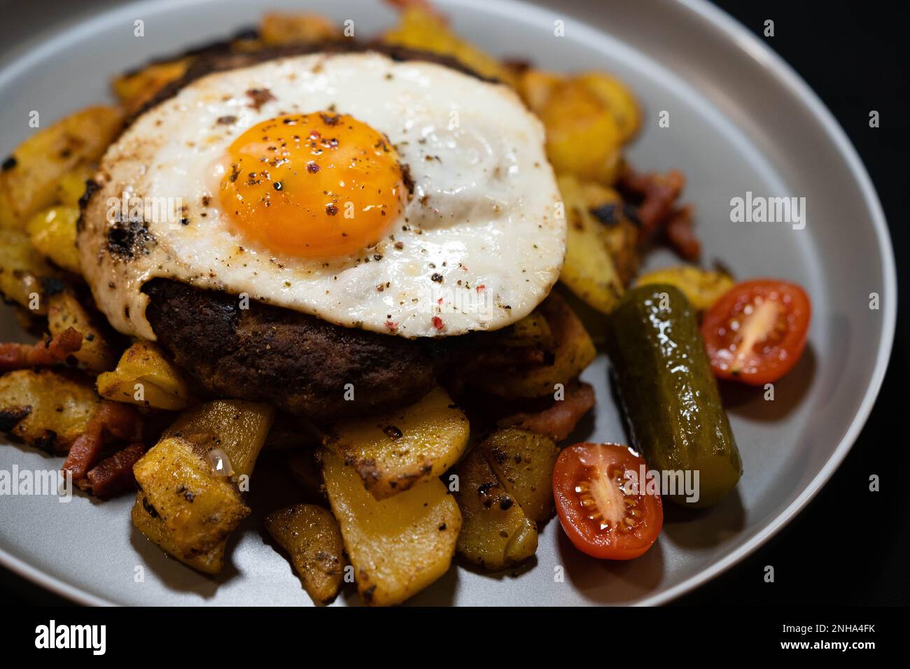 Hacksteak a la Meier Beefsteak with fried eggs and roasted potatoes ...