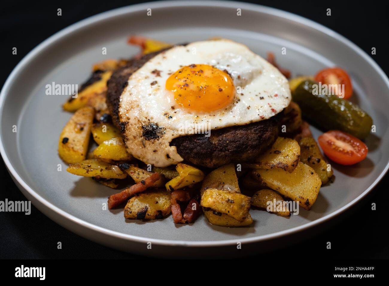 Hacksteak a la Meier Beefsteak with fried eggs and roasted potatoes ...