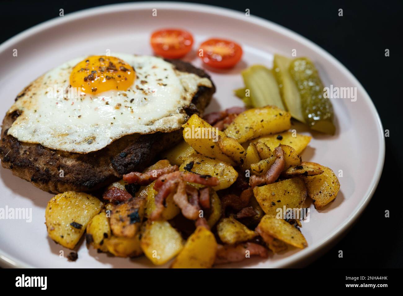 Hacksteak a la Meier Beefsteak with fried eggs and roasted potatoes ...