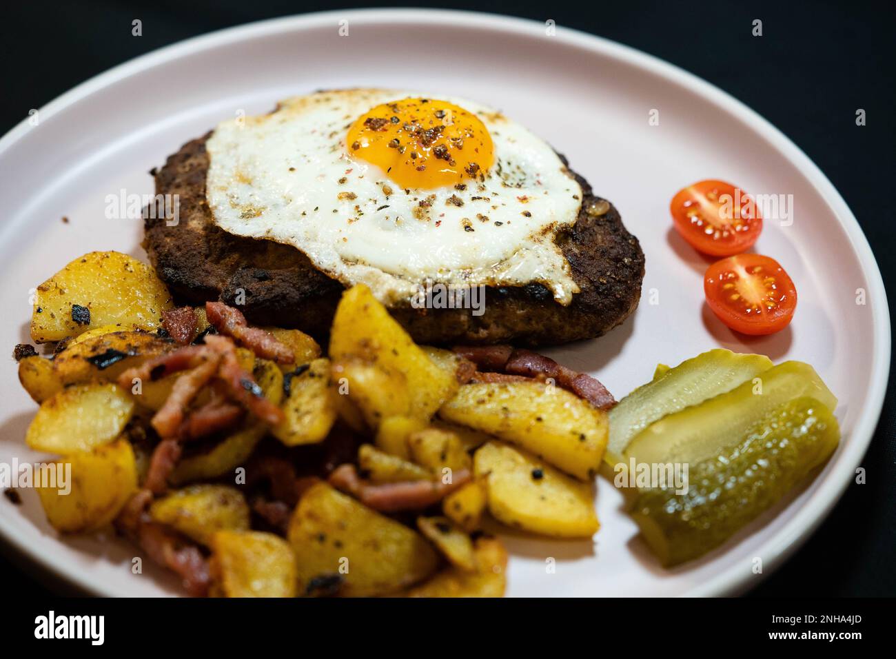 Hacksteak a la Meier Beefsteak with fried eggs and roasted potatoes ...