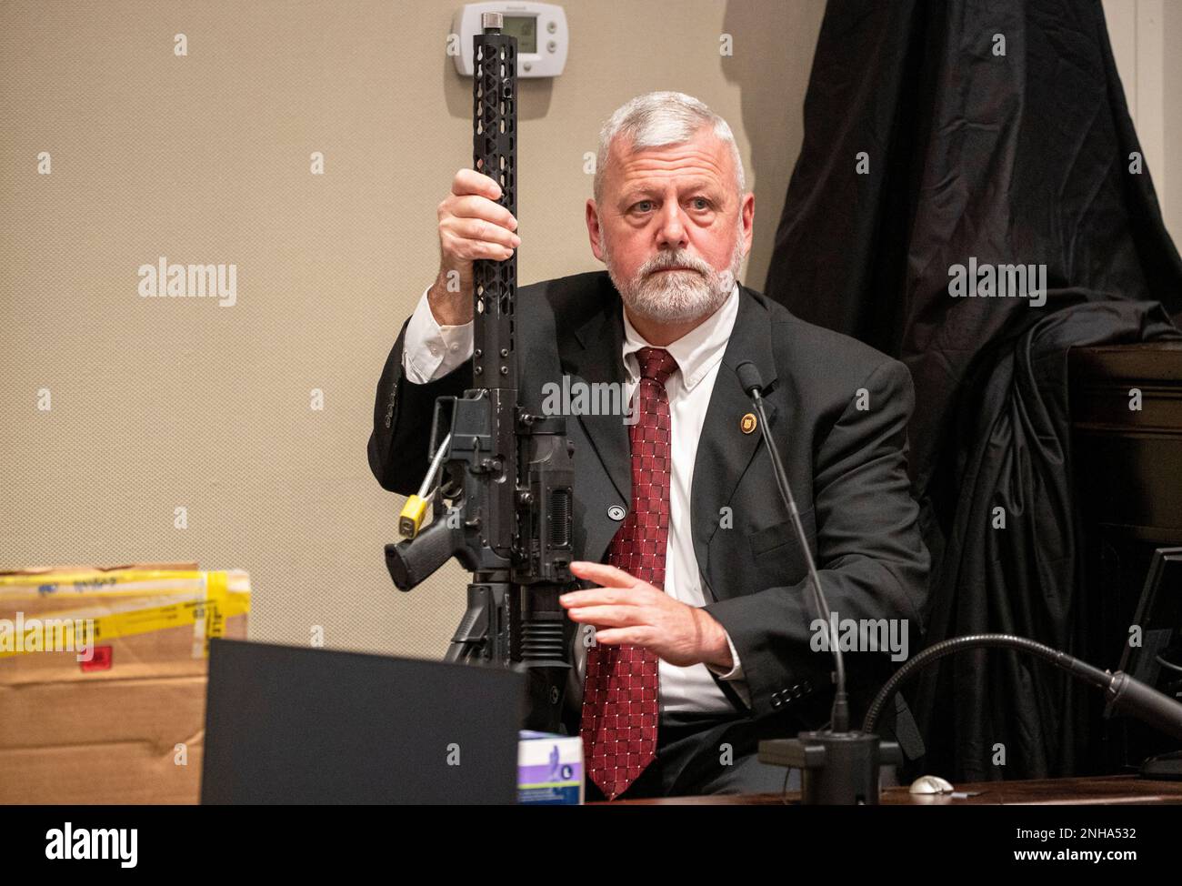 SLED agent Jeff Croft holds a .300 blackout rifle while being cross ...