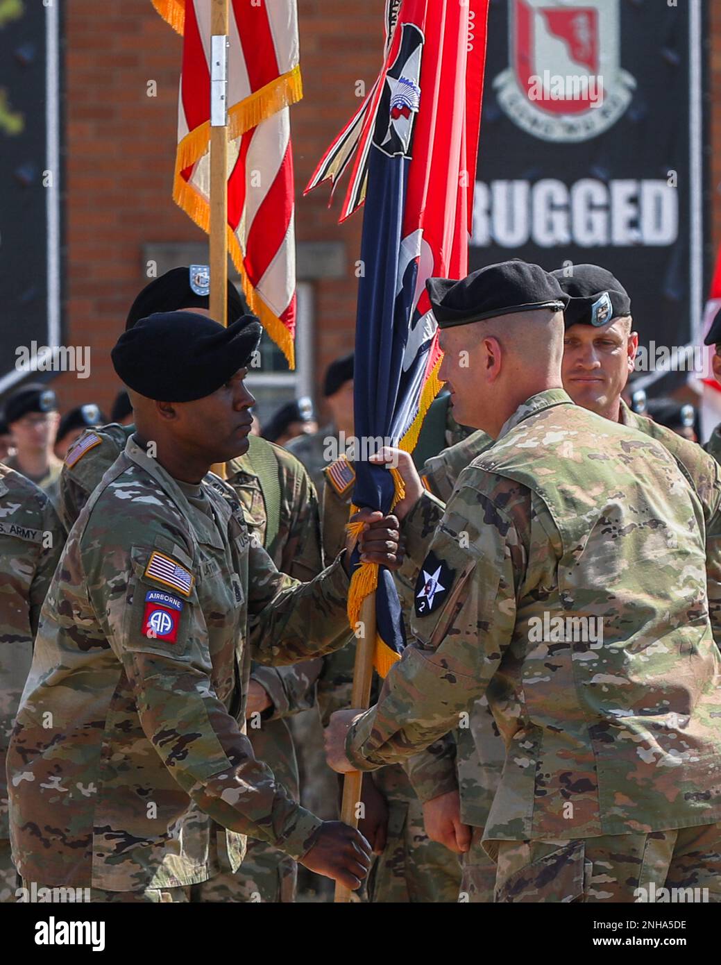 Col. Chad Roehrman, commander of 2nd Stryker Brigade Combat Team, 7th Infantry Division, hands ...