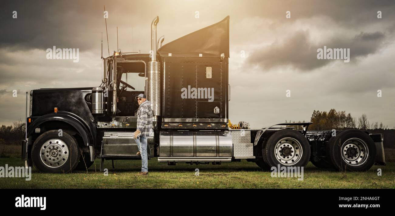 Caucasian American Semi Truck Driver Next to Tractor Truck. Heavy Duty ...
