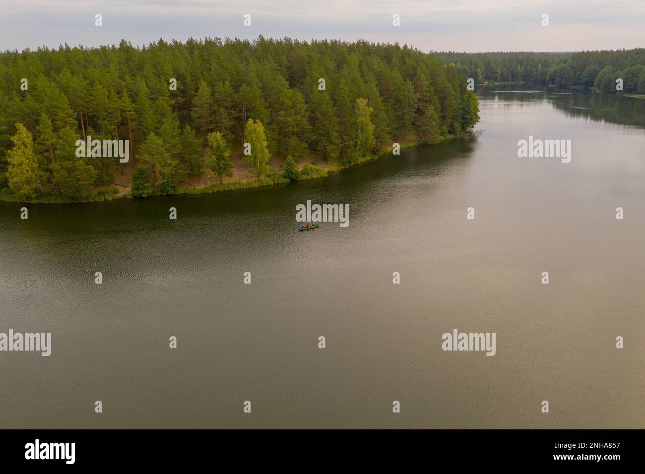 Drone photography of boat rowing in lake during summer day Stock Photo ...