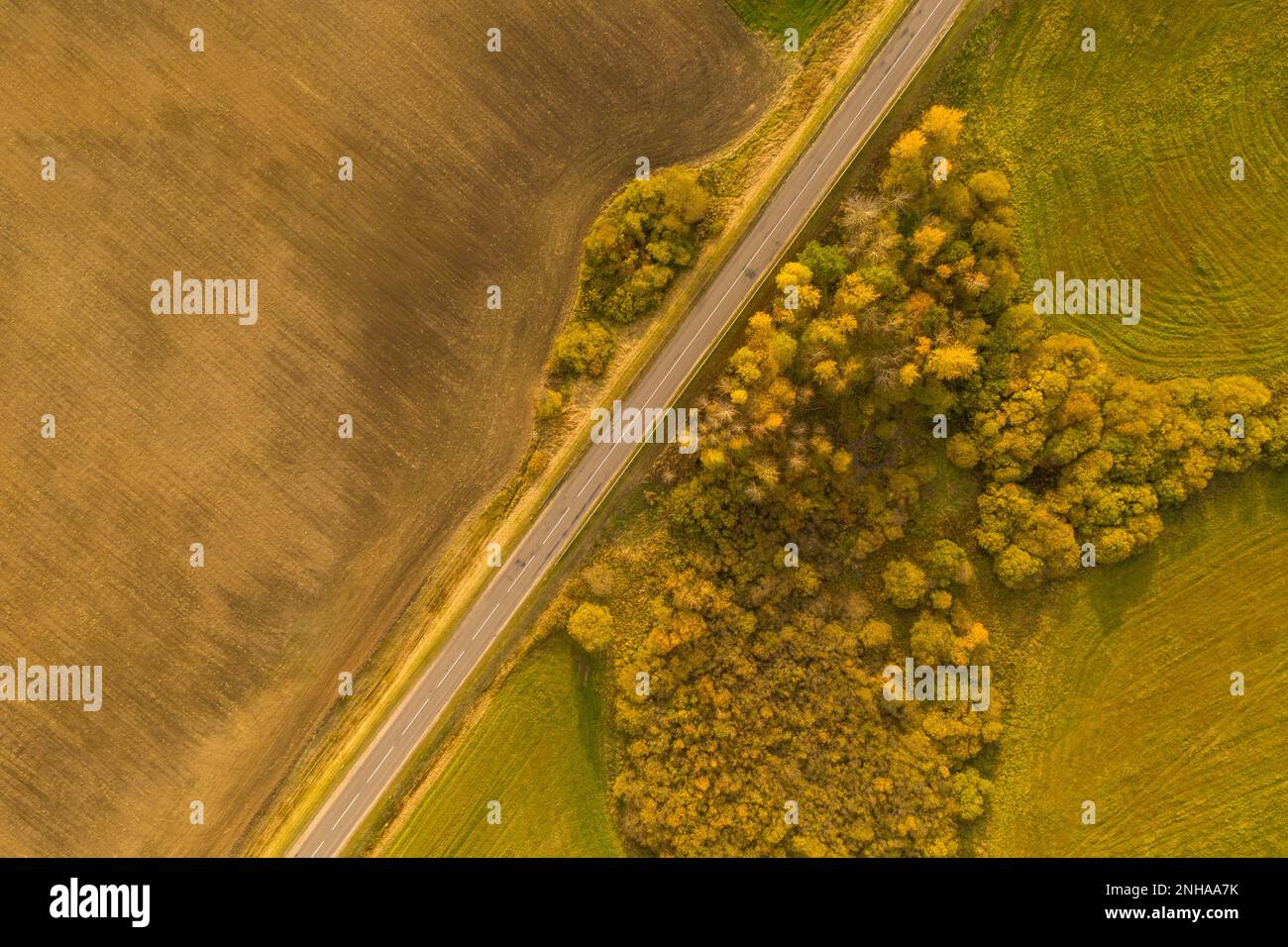 Drone photography of top view road through agriculture land during ...