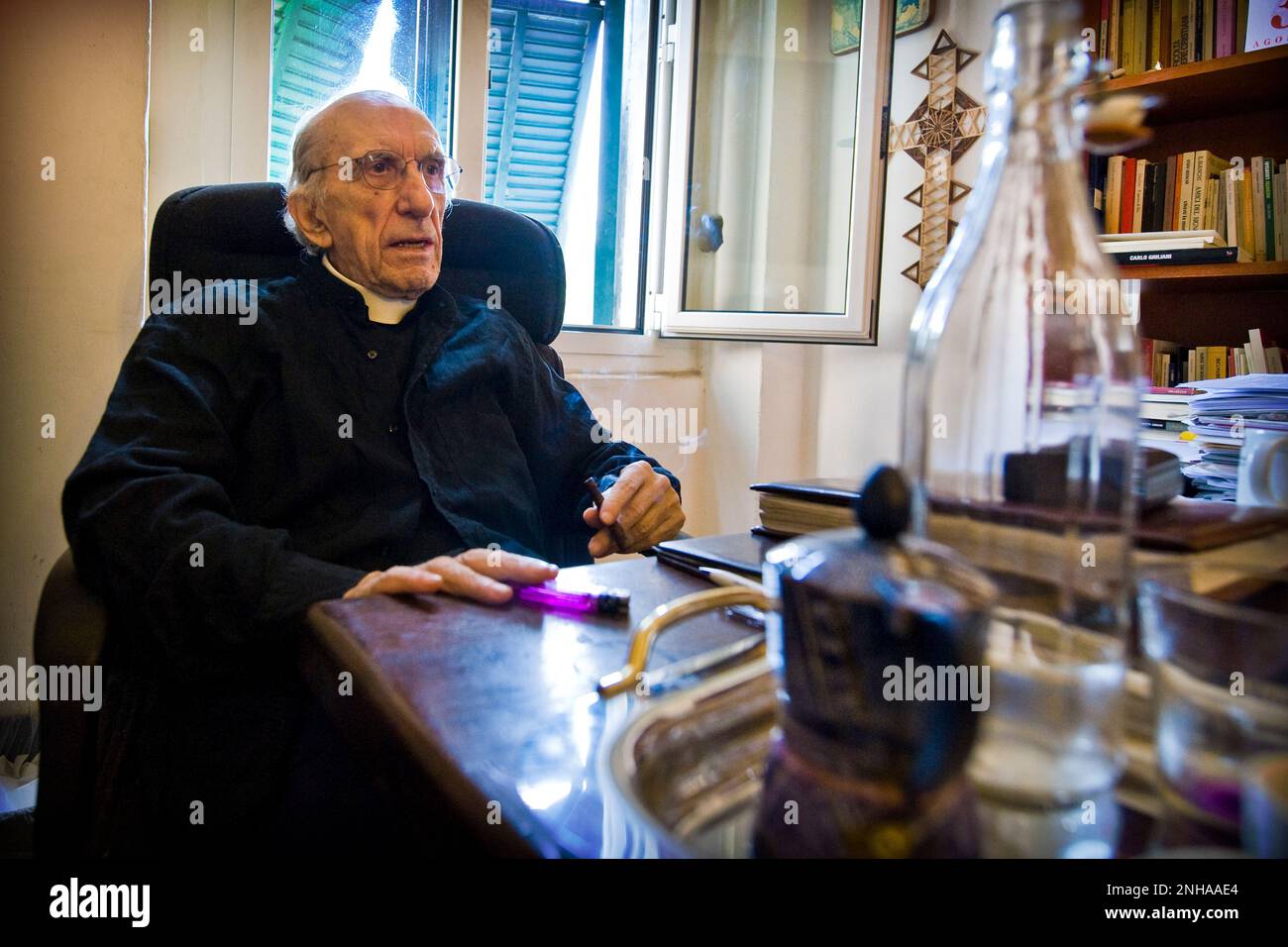 Don Andrea in her office during an interview. Don Andrea Gallo, Genoa ...