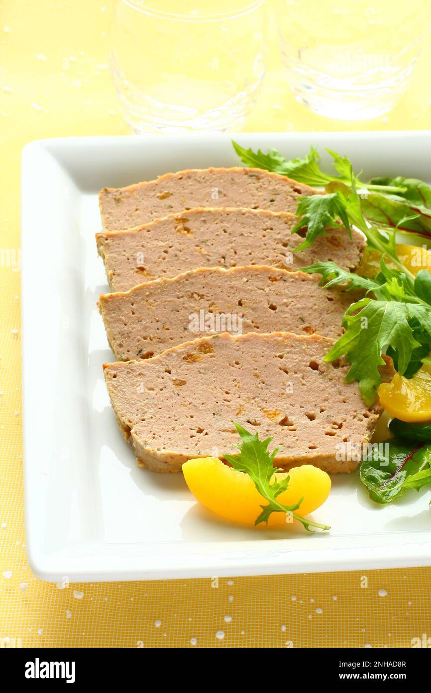 meat pate with peach and salad garnish Stock Photo - Alamy