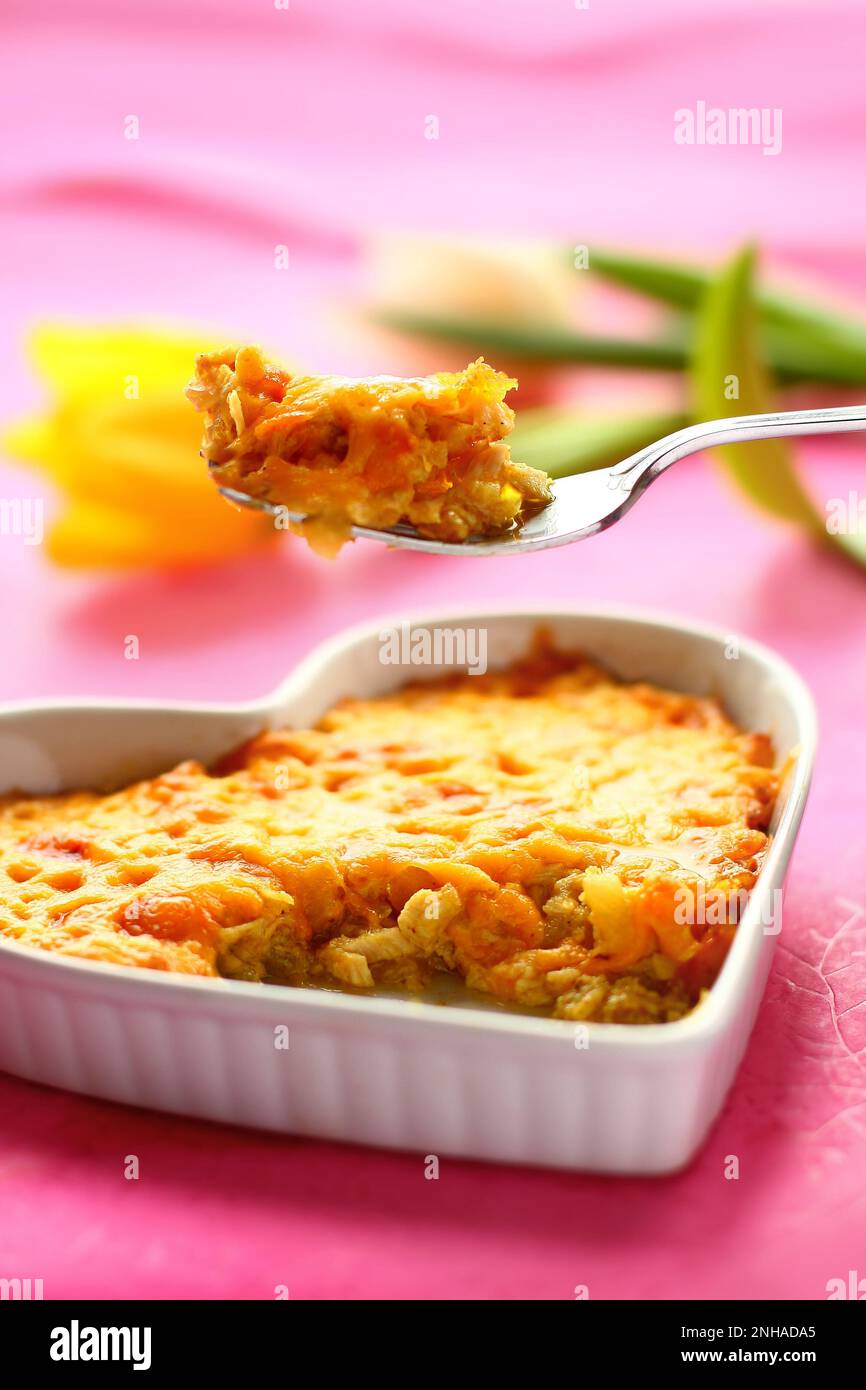 chicken and cheese gratin in baking dish Stock Photo - Alamy