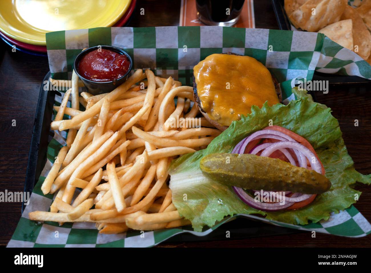 Dinner at Sweeney's Saloon French fries cheeseburger pickle onion ...