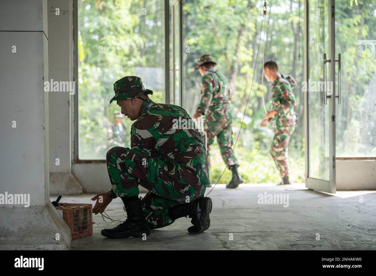 Indonesian Army soldiers conduct a culminating explosive ordnance ...