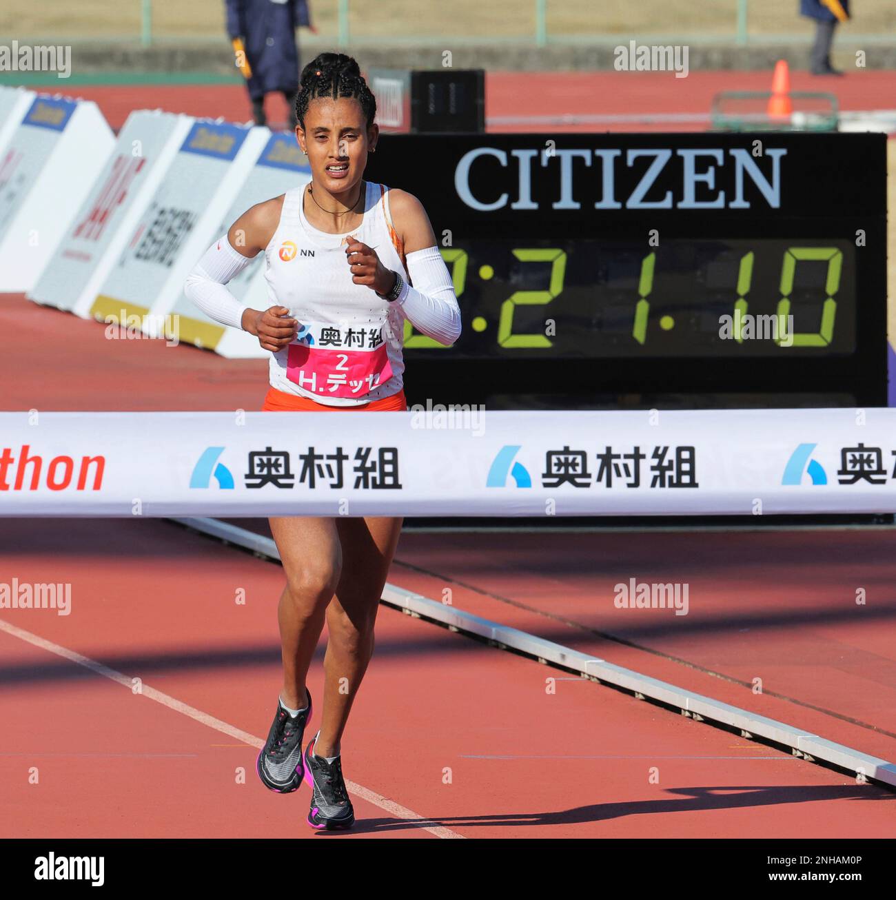 Haven Hailu Desse of Ethiopia crosses a finish line during 2023 Osaka ...