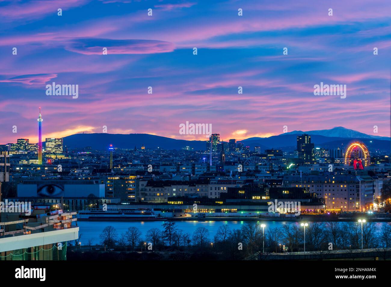 Wien, Vienna: fiery sunset at river Donau (Danube), amusement park ...