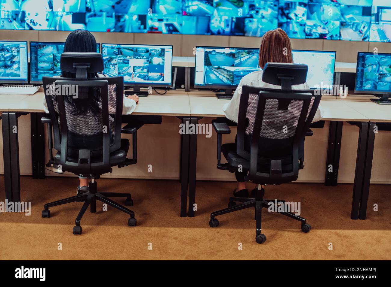 Group of Security data center operators working in a CCTV monitoring ...