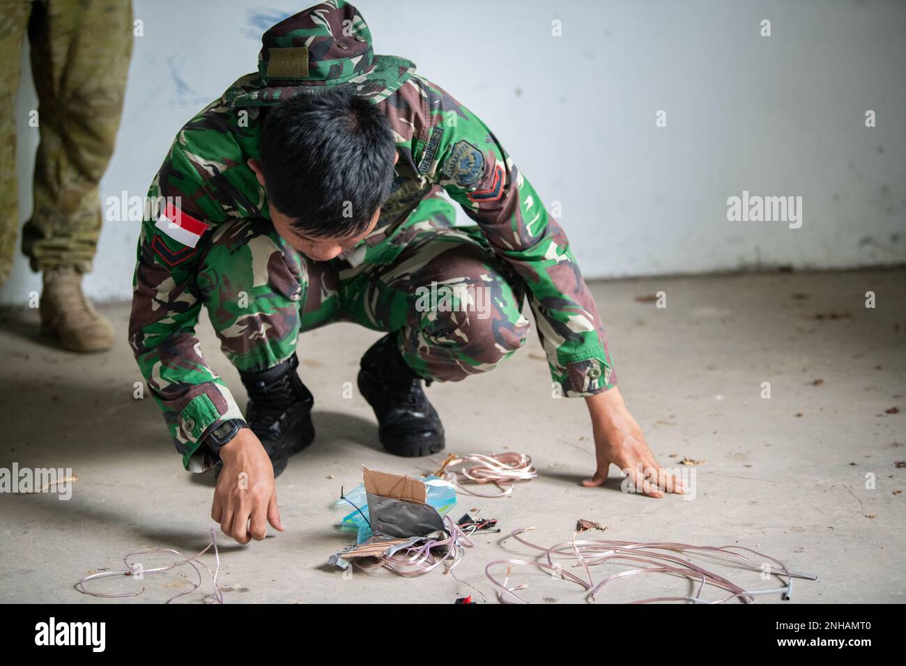 Indonesian Army soldiers conduct a culminating explosive ordnance ...