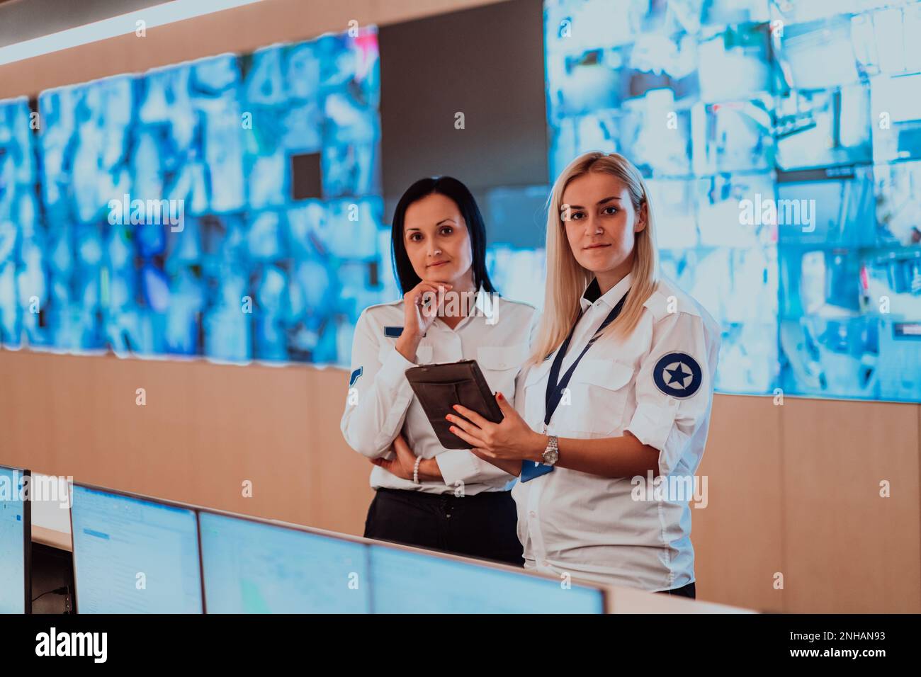Group portrait of female security operator while working in a data ...