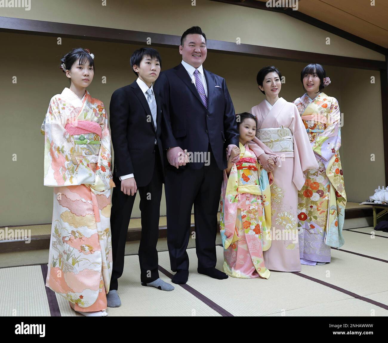 Former yokozuna Hakuho (3rd from L) with his wife Sayoko (2nd from R ...