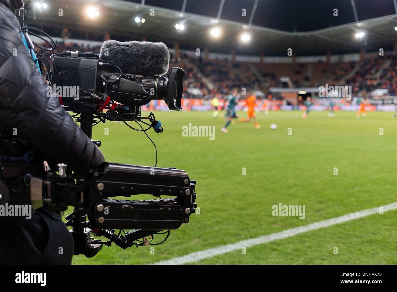 Cameraman behind playing field during soccer match Stock Photo - Alamy