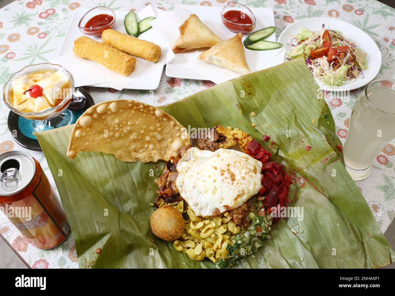 Dishes of Sri Lanka Lamprice, Sri Lanka Roll, Kiri Pani and Samosa are ...