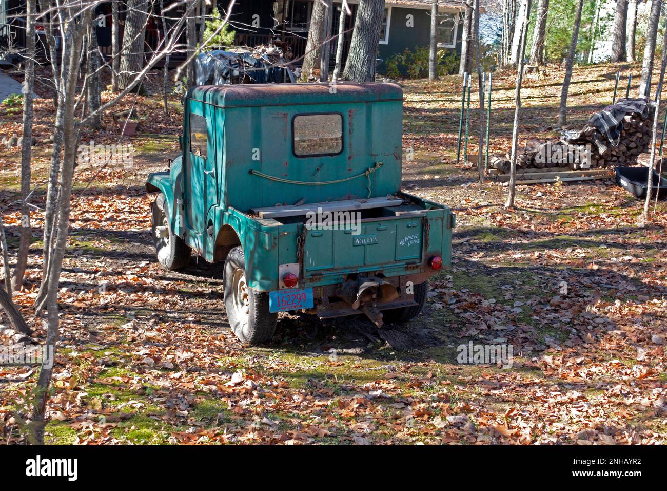Working vintage aqua Jeep pickup truck used for chores around the ...