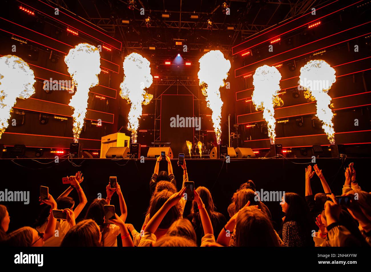 Empty concert stage with fires. Atmosphere of concert. Audience in ...